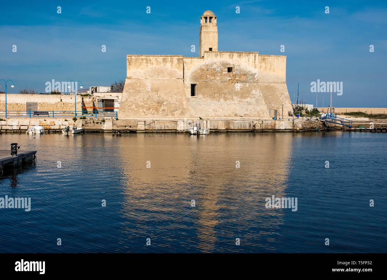 Italy, Marina di Ostuni, view of the port and the castle Stock Photo ...