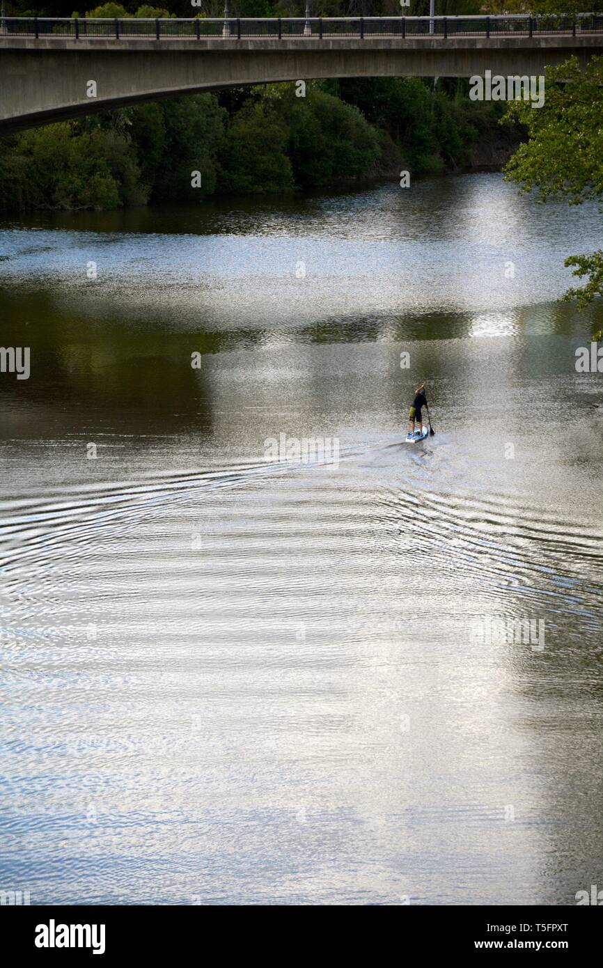 one person in a river on a canoe Stock Photo - Alamy