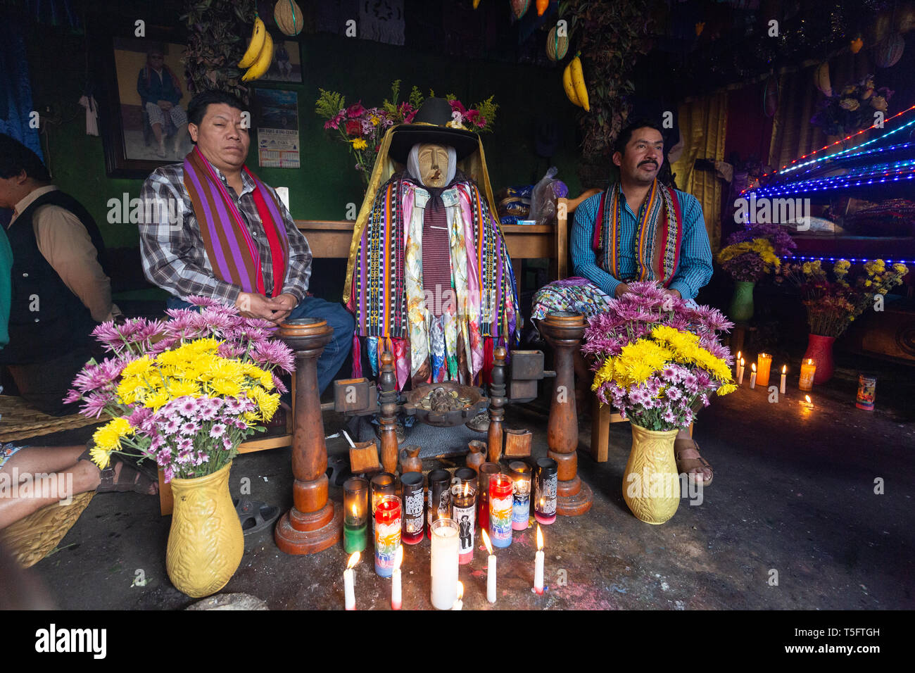 Local mayan people with the idol of Maximon, or San Simon, a ...