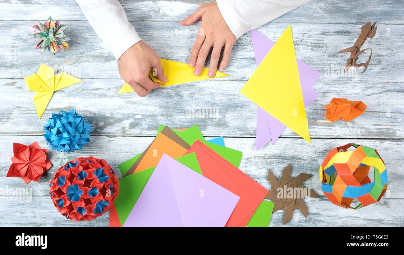 Torning green paper hands hi-res stock photography and images - Alamy