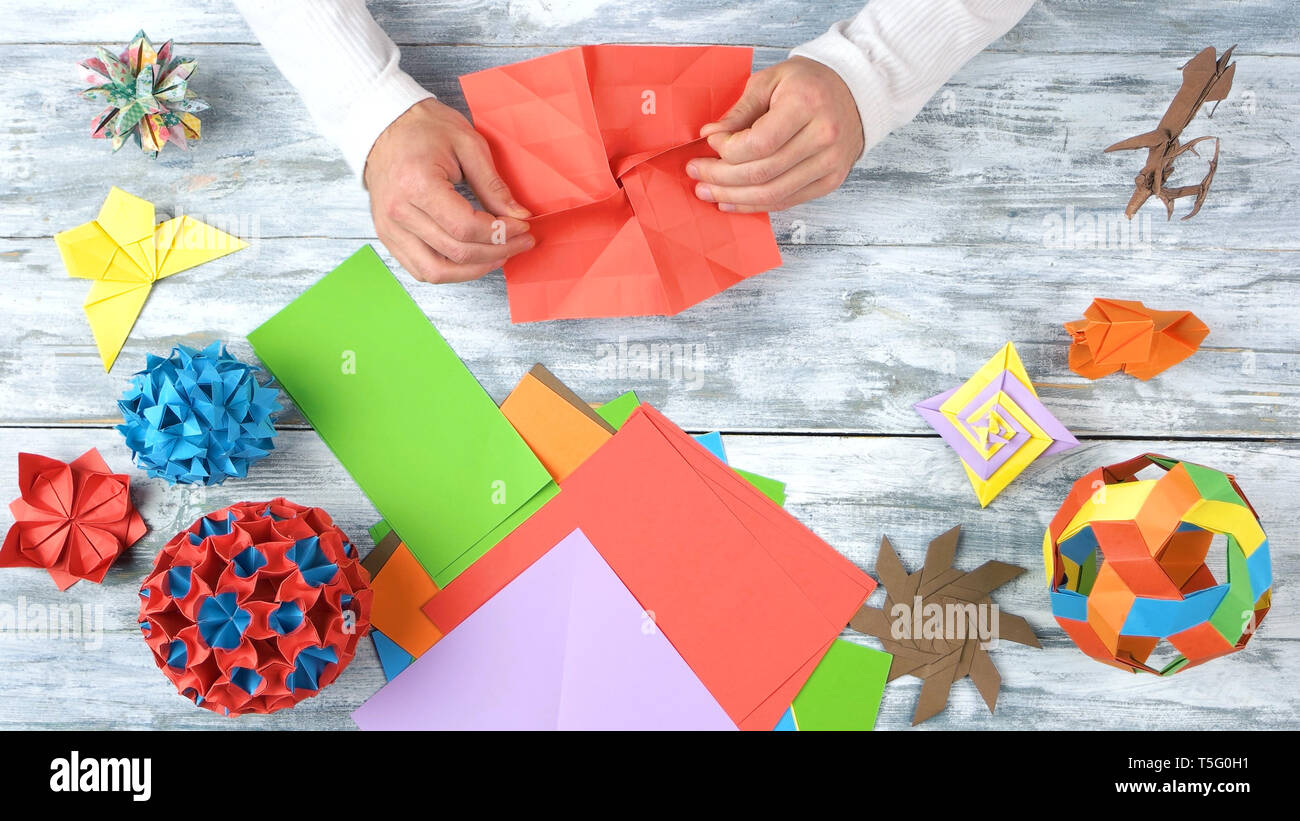 Origami projects on white wooden background Stock Photo - Alamy