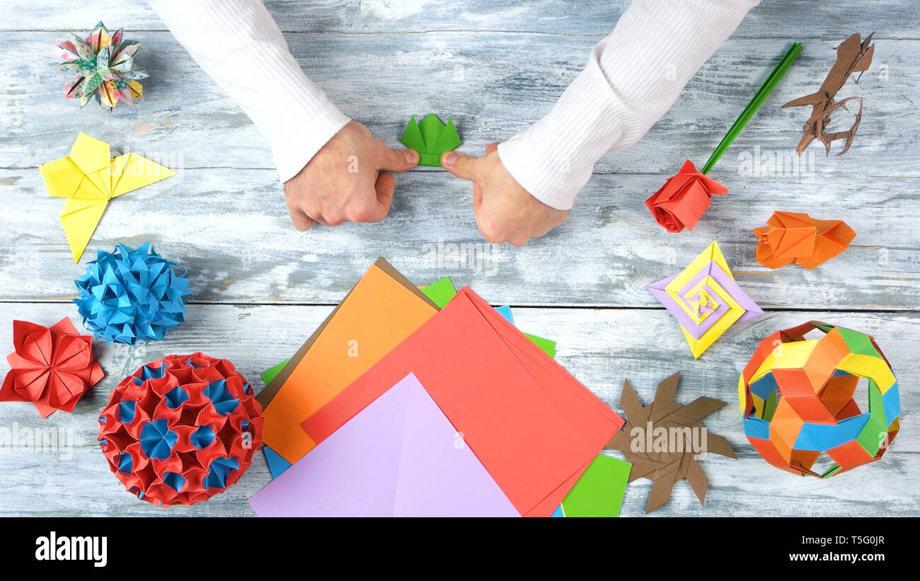 Creative man folding origami workspace hi-res stock photography and ...