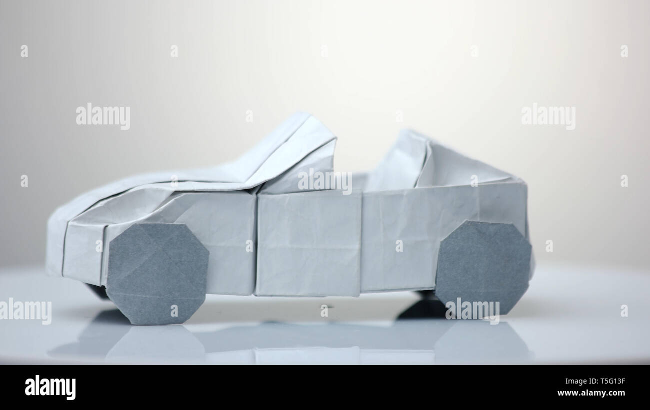 Origami car model on white background Stock Photo - Alamy