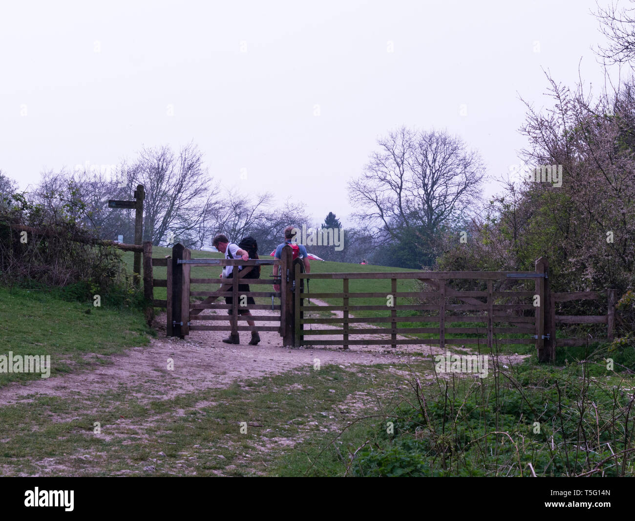 Walkers passing through gate hi-res stock photography and images - Alamy