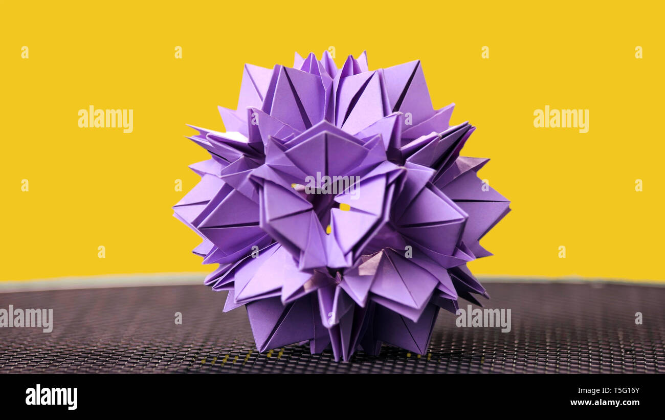 Paper figurine made of folded colorful paper Stock Photo - Alamy