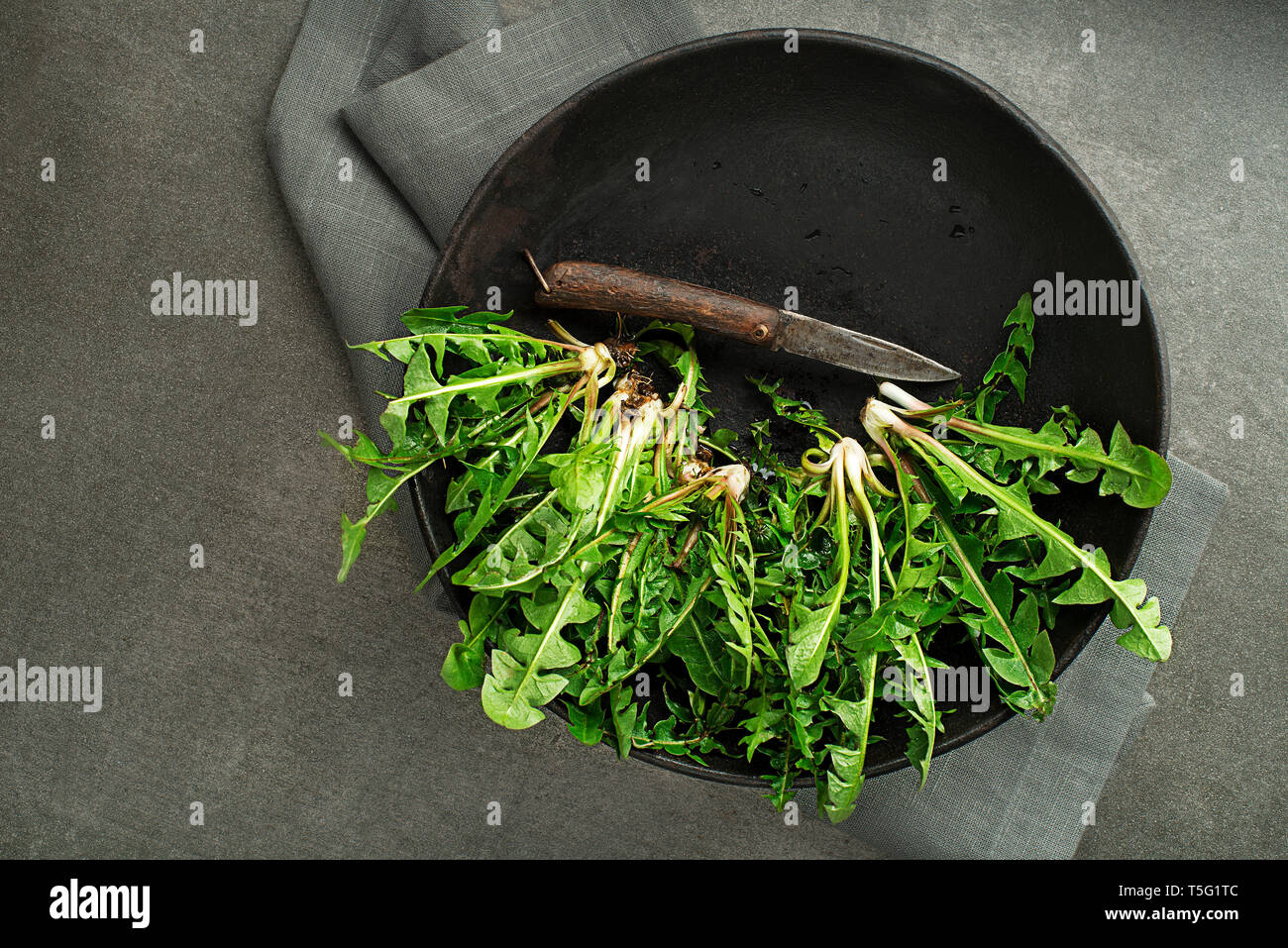 Fresh dandelion leaves overhead shoot. Healthy natural organic food ...