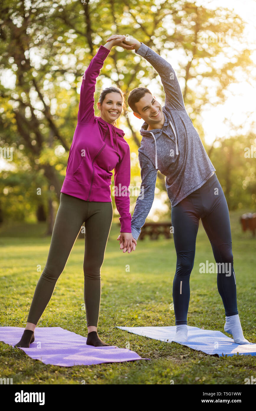 Physical therapist is showing exercises for sciatica recovery to young ...