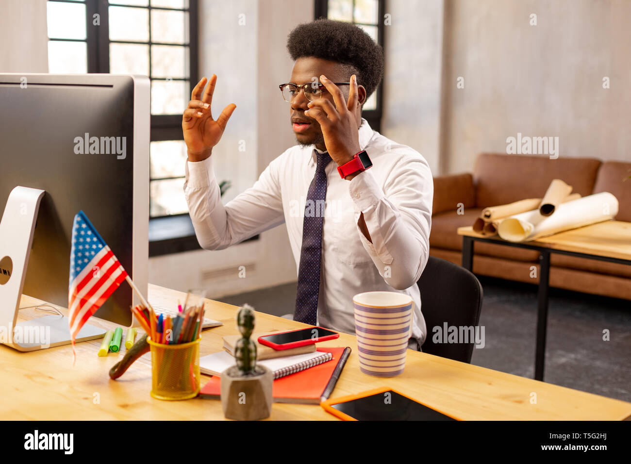 Smart emotional man looking at the computer Stock Photo - Alamy