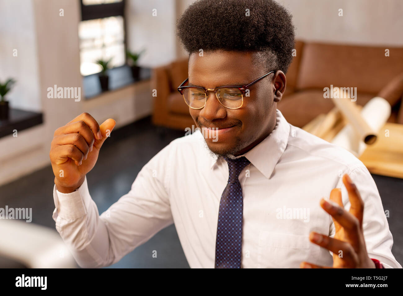 Nice smart young man showing his emotions Stock Photo - Alamy