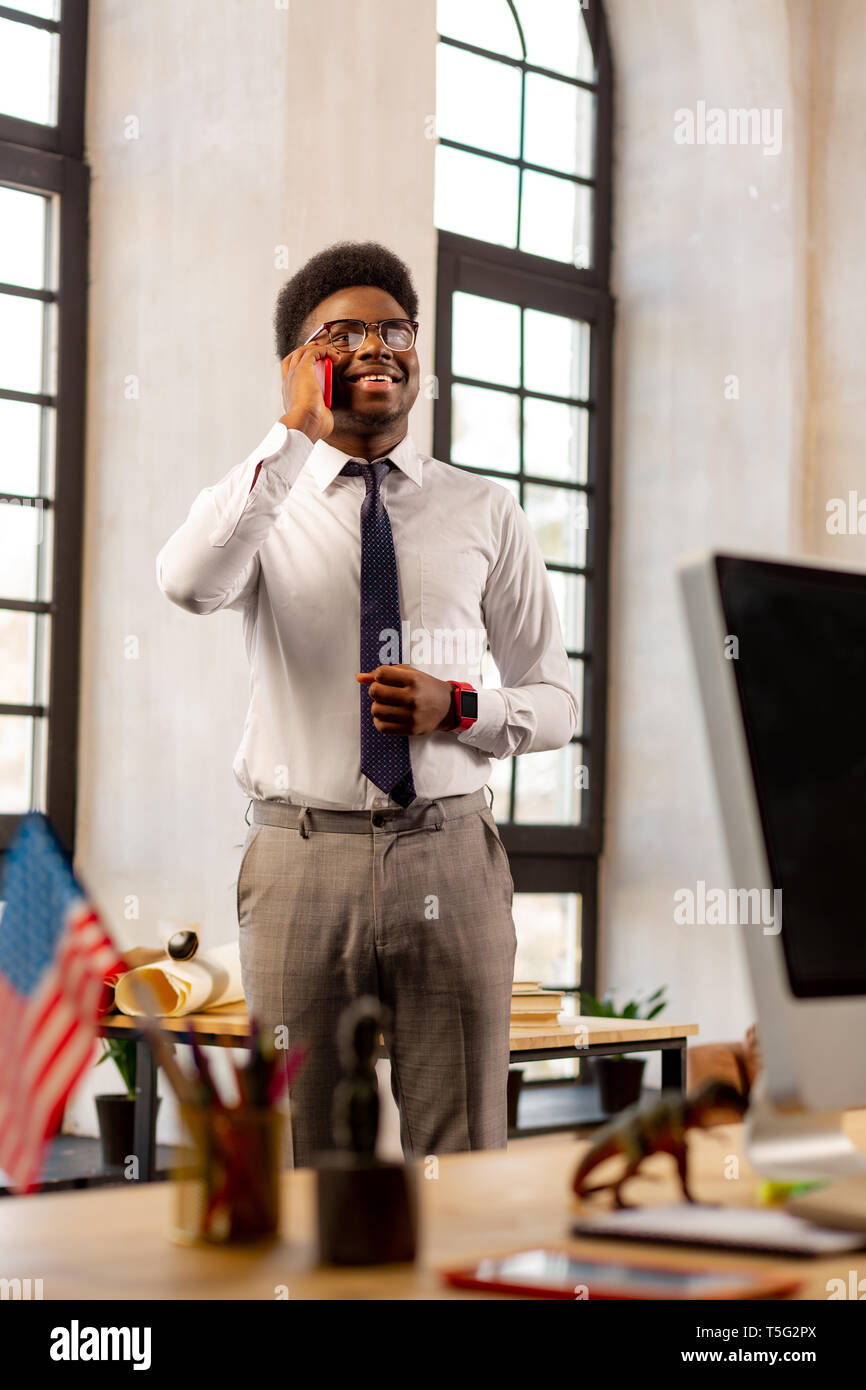 Delighted nice man having a pleasant conversation Stock Photo - Alamy