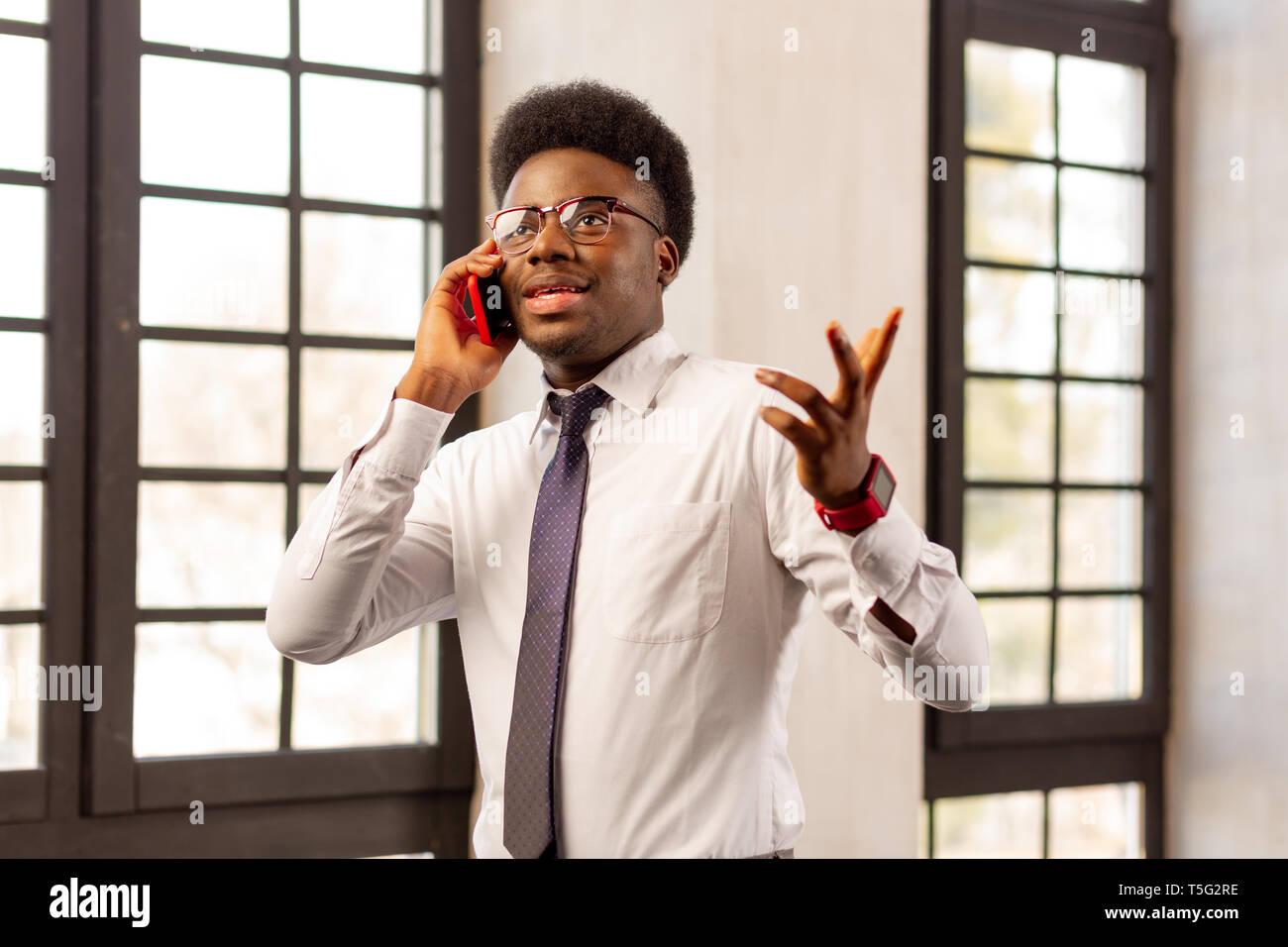 Good looking young man making an appointment on the phone Stock Photo ...