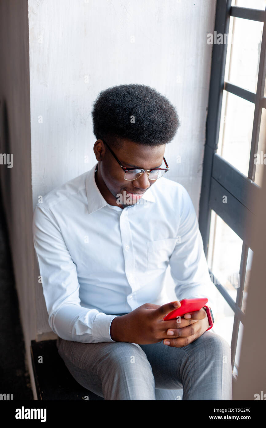 Positive nice man looking at his messages Stock Photo - Alamy