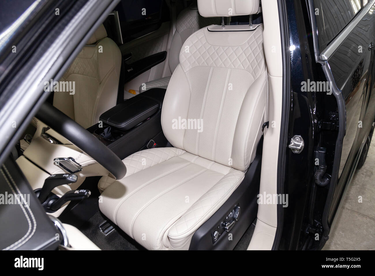 A view of a part of the interior of the car dashboard and seats from ...