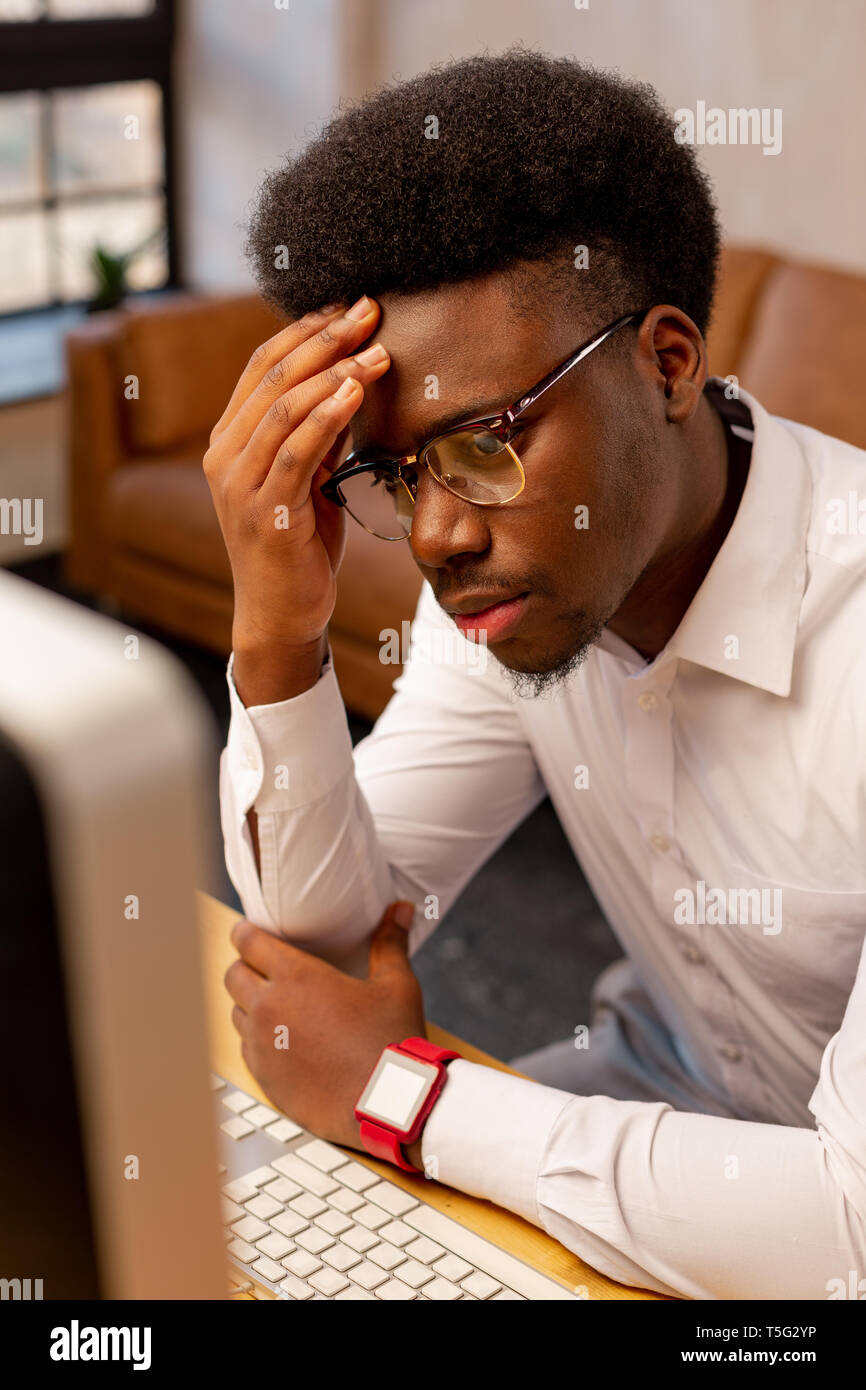Nice tired man needing a rest from work Stock Photo - Alamy