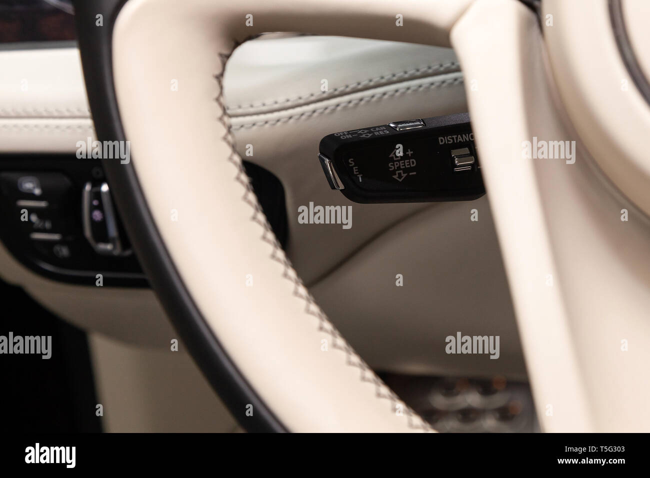 The shift lever to set the automatic cruise control speed inside the ...