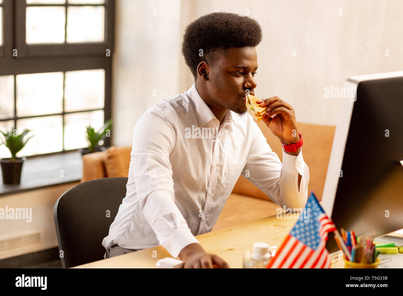 Man biting sandwich hi-res stock photography and images - Alamy