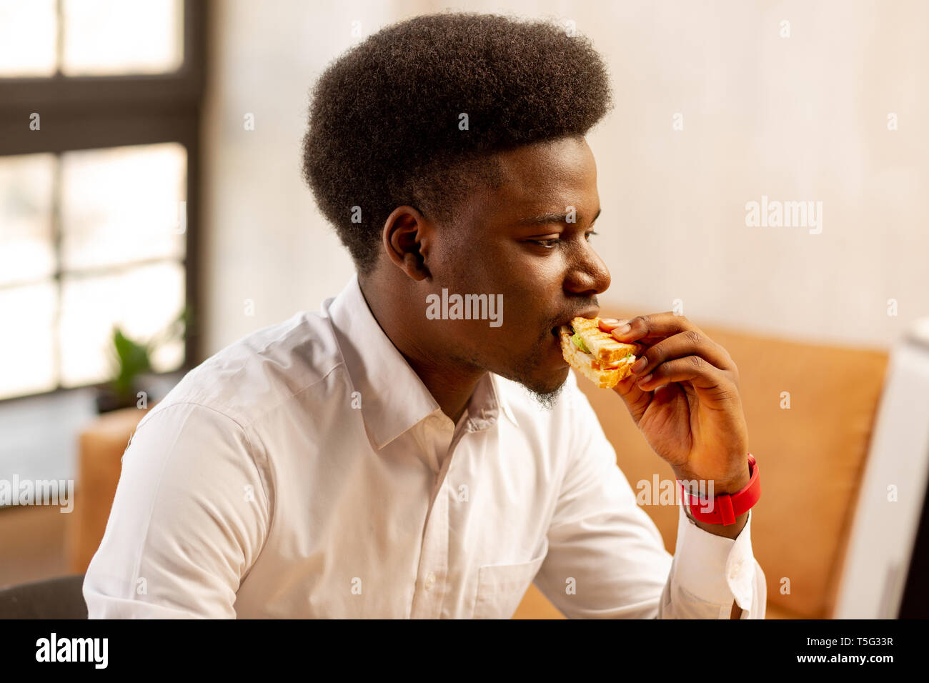 Man eating sandwich work hi-res stock photography and images - Alamy