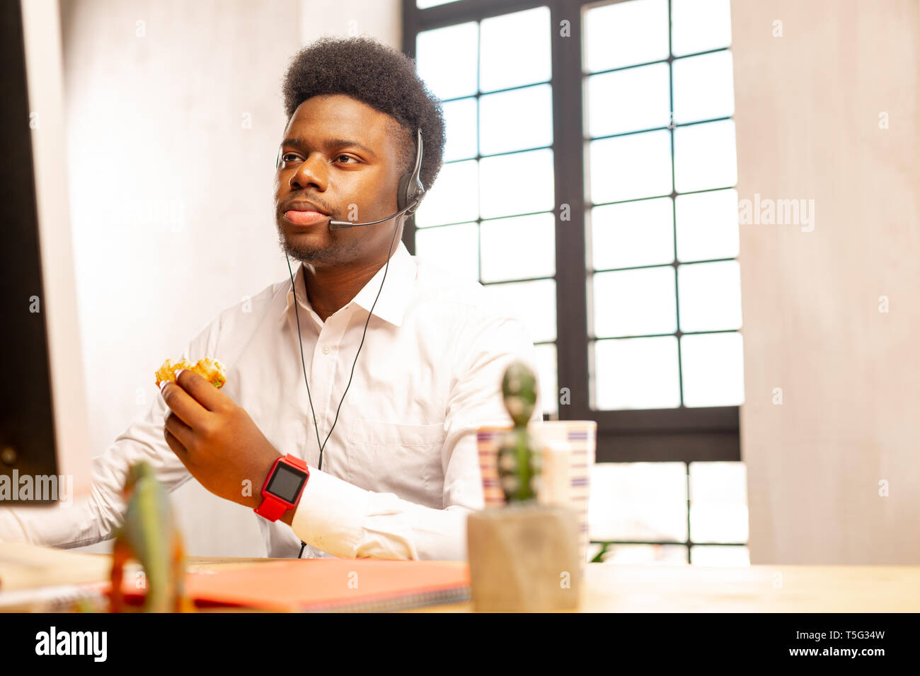 Nice African American man wearing his headphones Stock Photo - Alamy