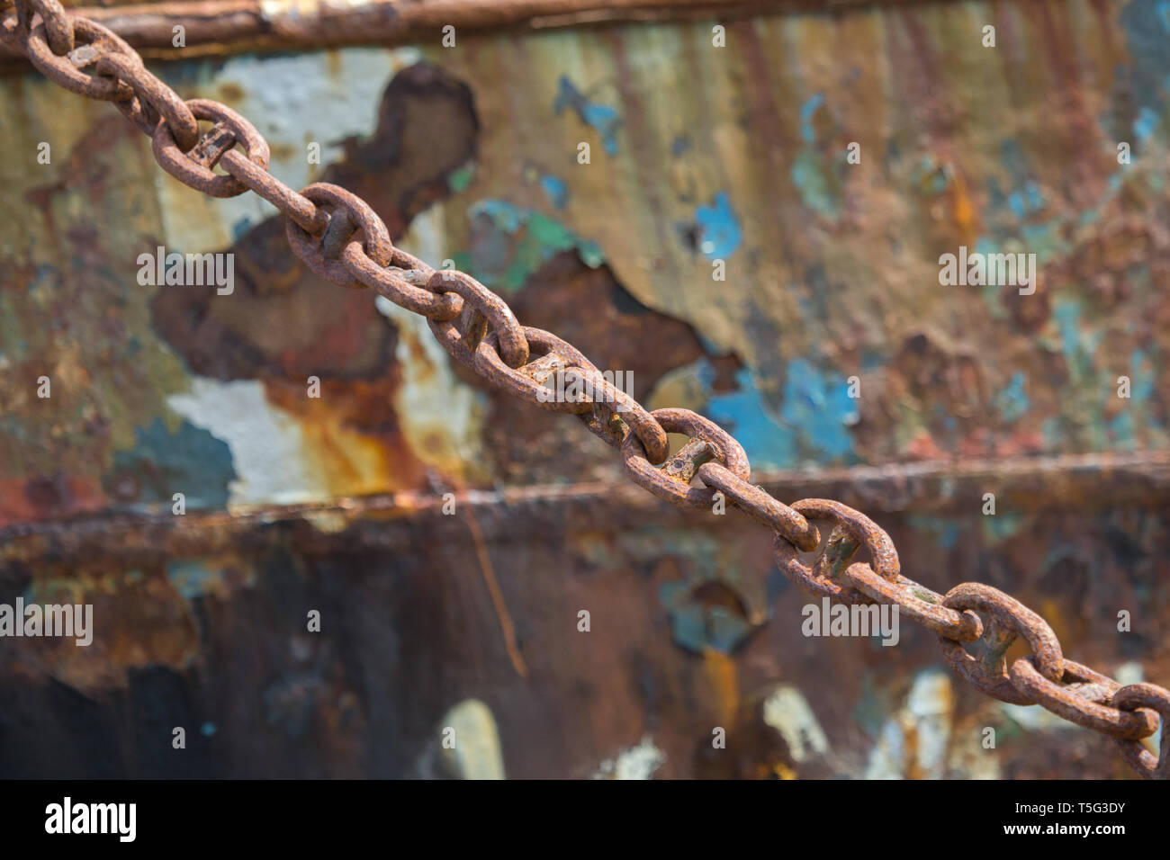 A ship wrecked fishing boat aground and abandoned rusting away on the ...