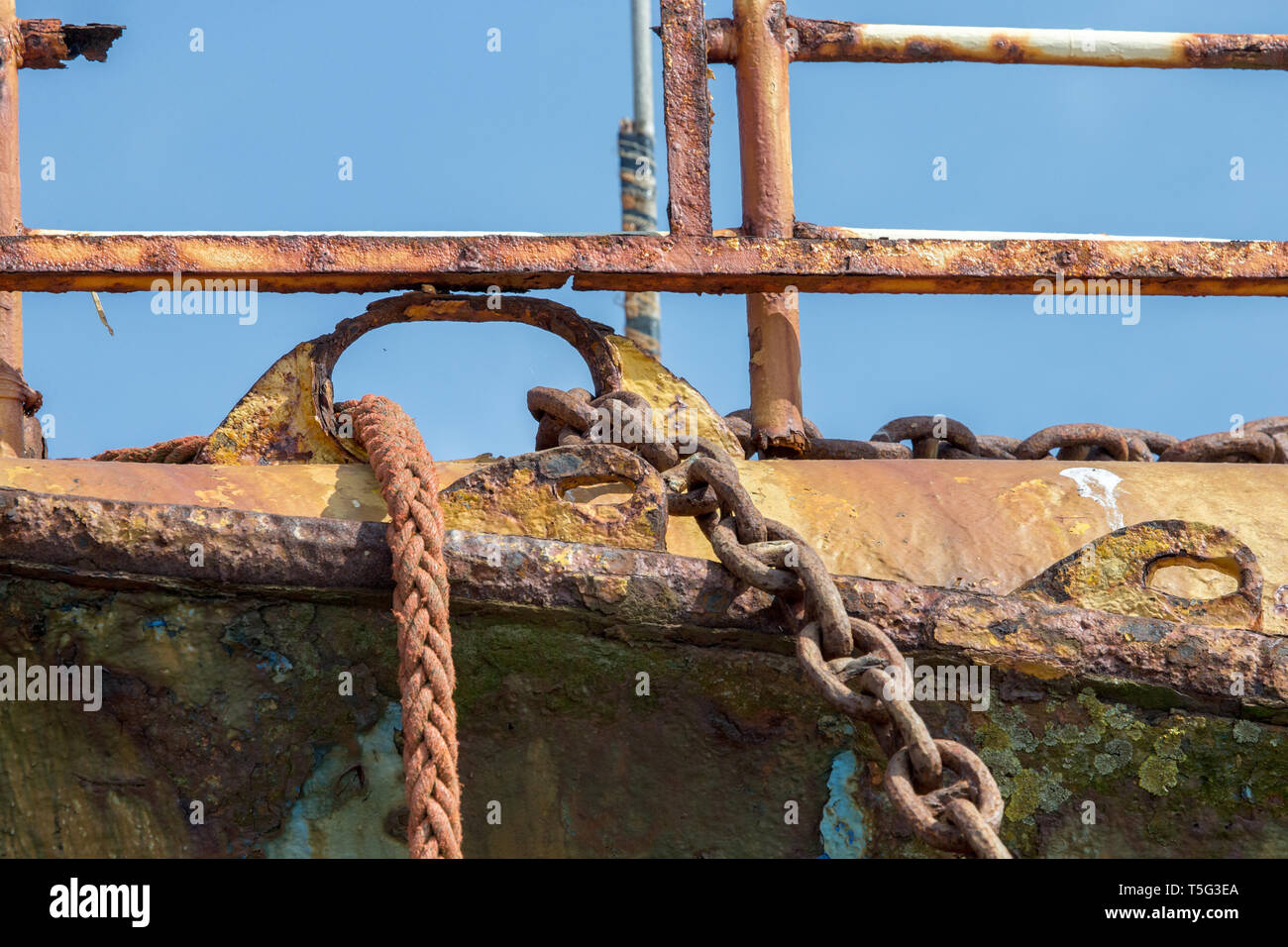 A ship wrecked fishing boat aground and abandoned rusting away on the ...