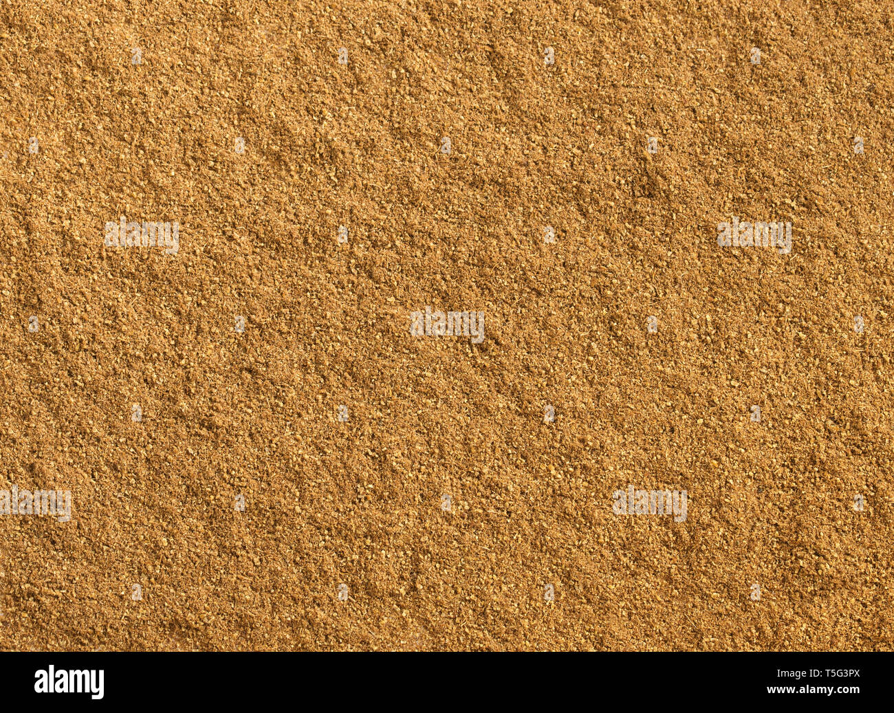 Cumin powder texture. Ground caraway seasoning background Stock Photo ...