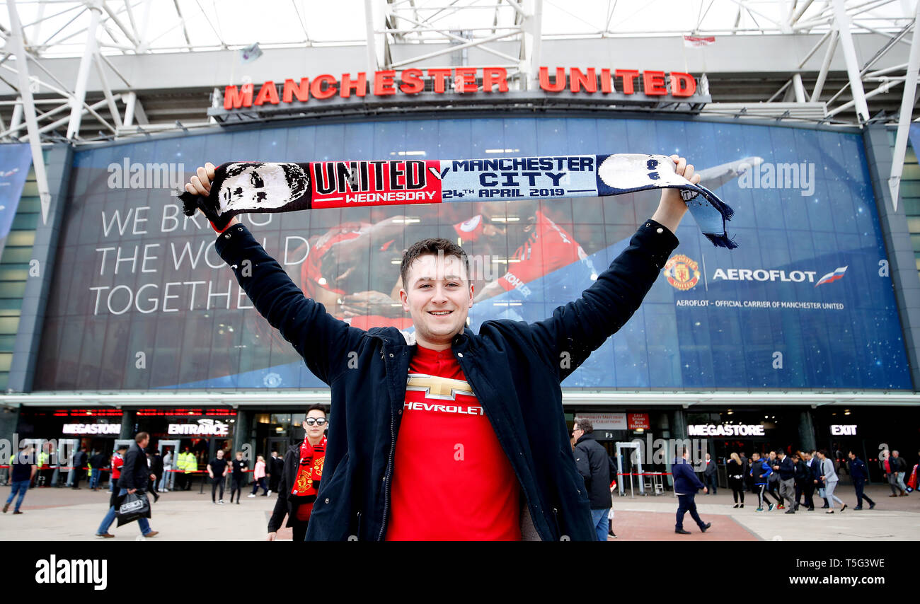 A Manchester United fan shows his support outside the ground before the ...