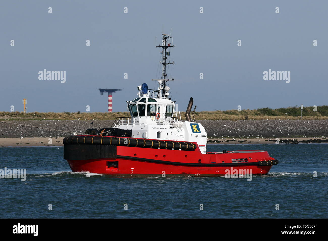 The harbor tug Rotterdam works on 10 April 2019 in the port of ...