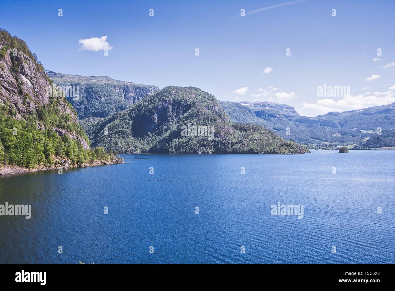 Blue sky and blue water in Norway Stock Photo - Alamy