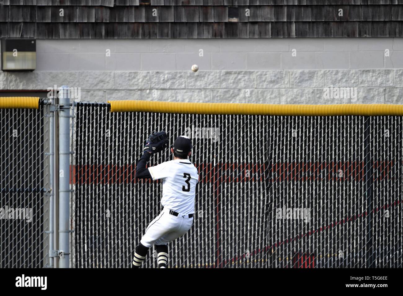 Ball over fence hi-res stock photography and images - Alamy