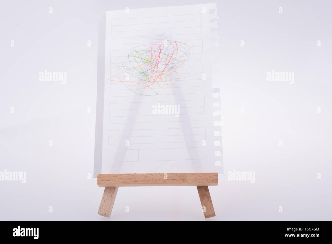 Sheet of white paper scribbled put on tripod for painting on white ...