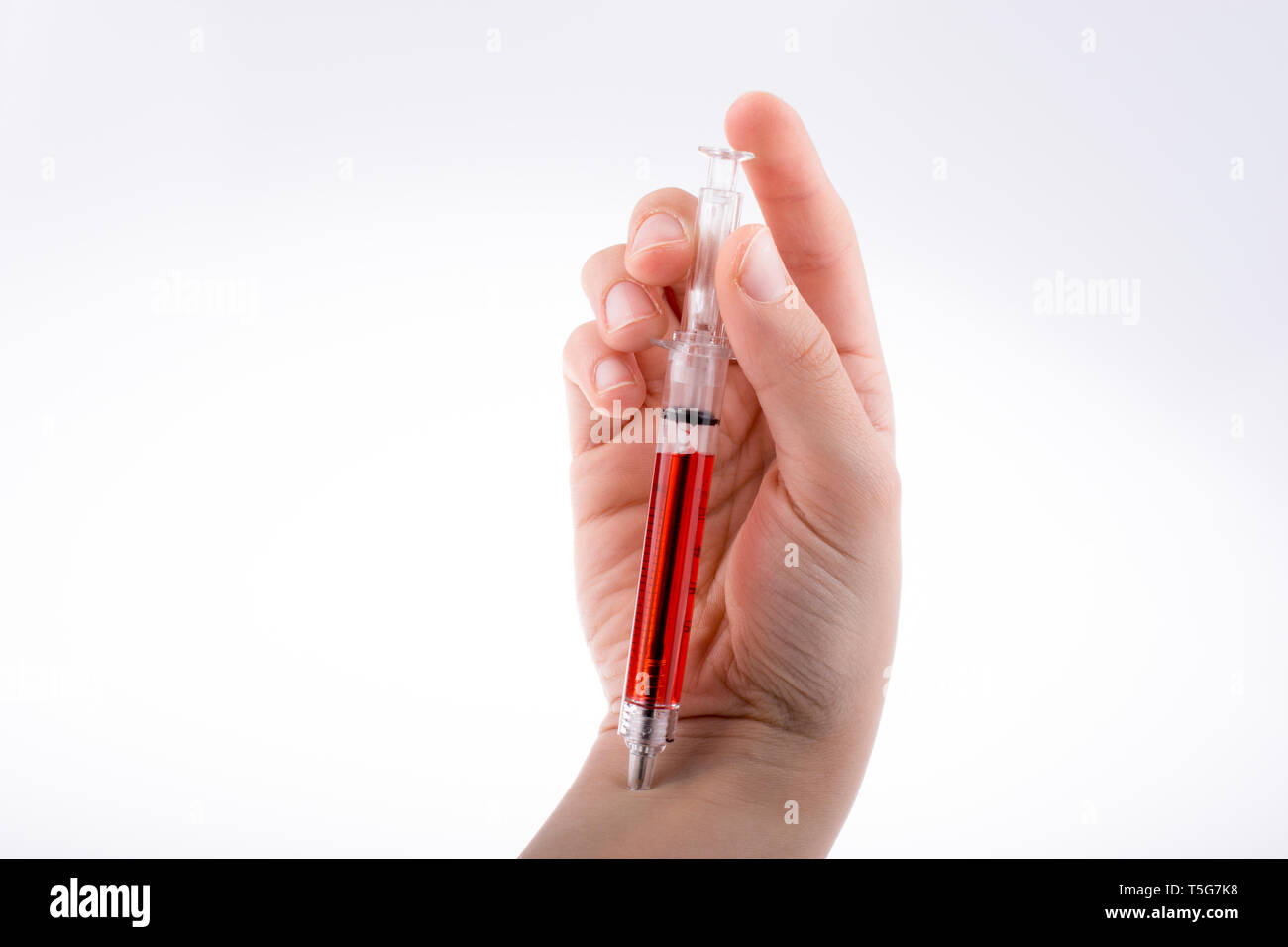 hand holding injection to itself on a white background Stock Photo - Alamy
