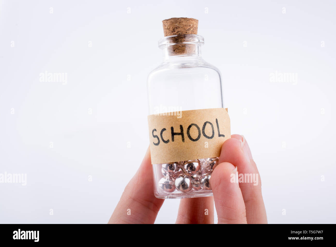 Little perfume glass bottle in hand on a white background Stock Photo ...
