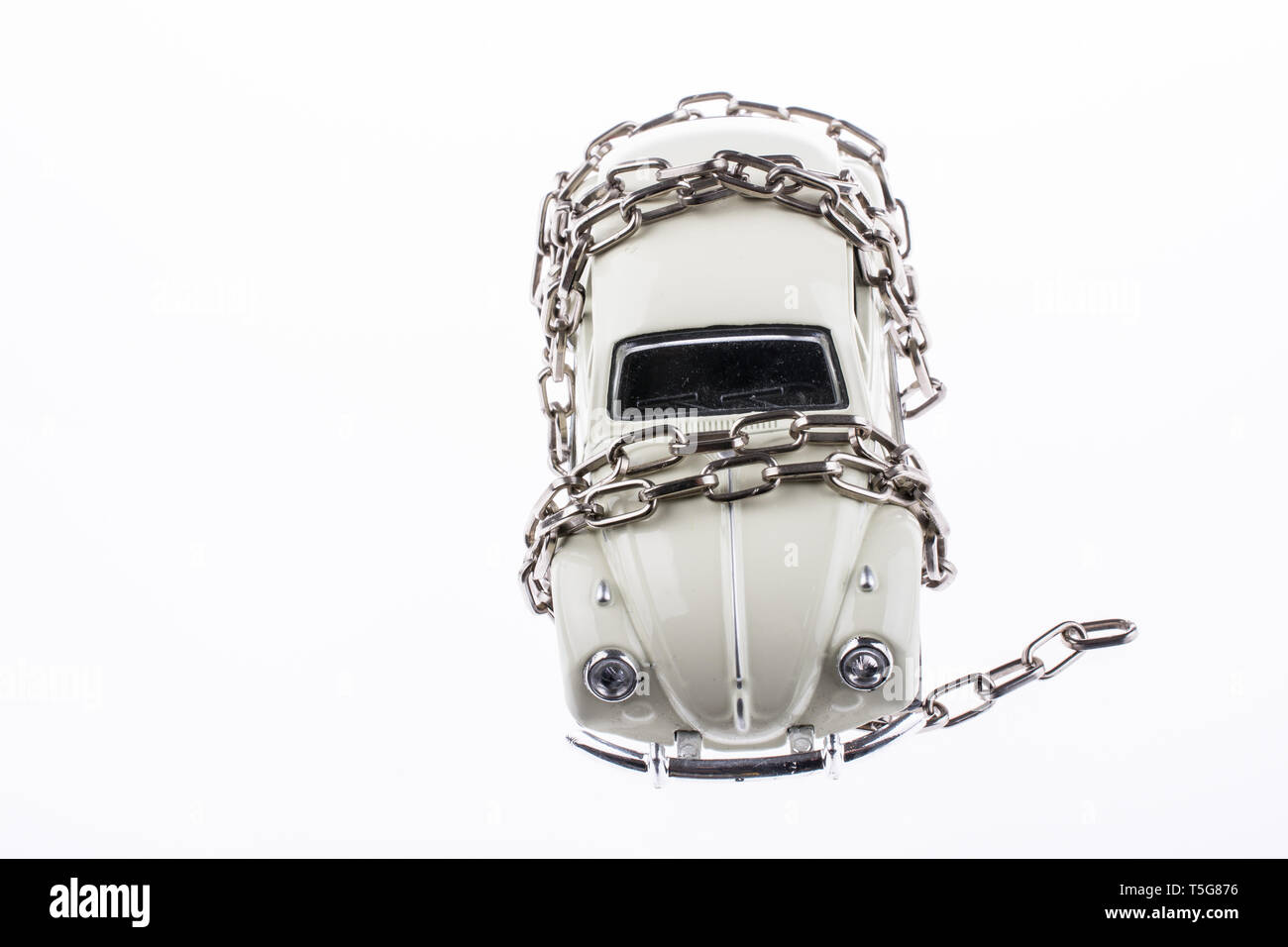 Chained white car on white background Stock Photo - Alamy