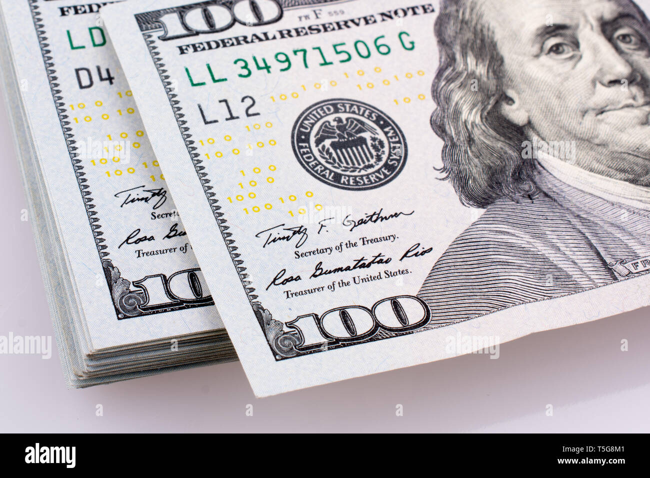 American 100 dollar banknotes made of paper placed on white background ...