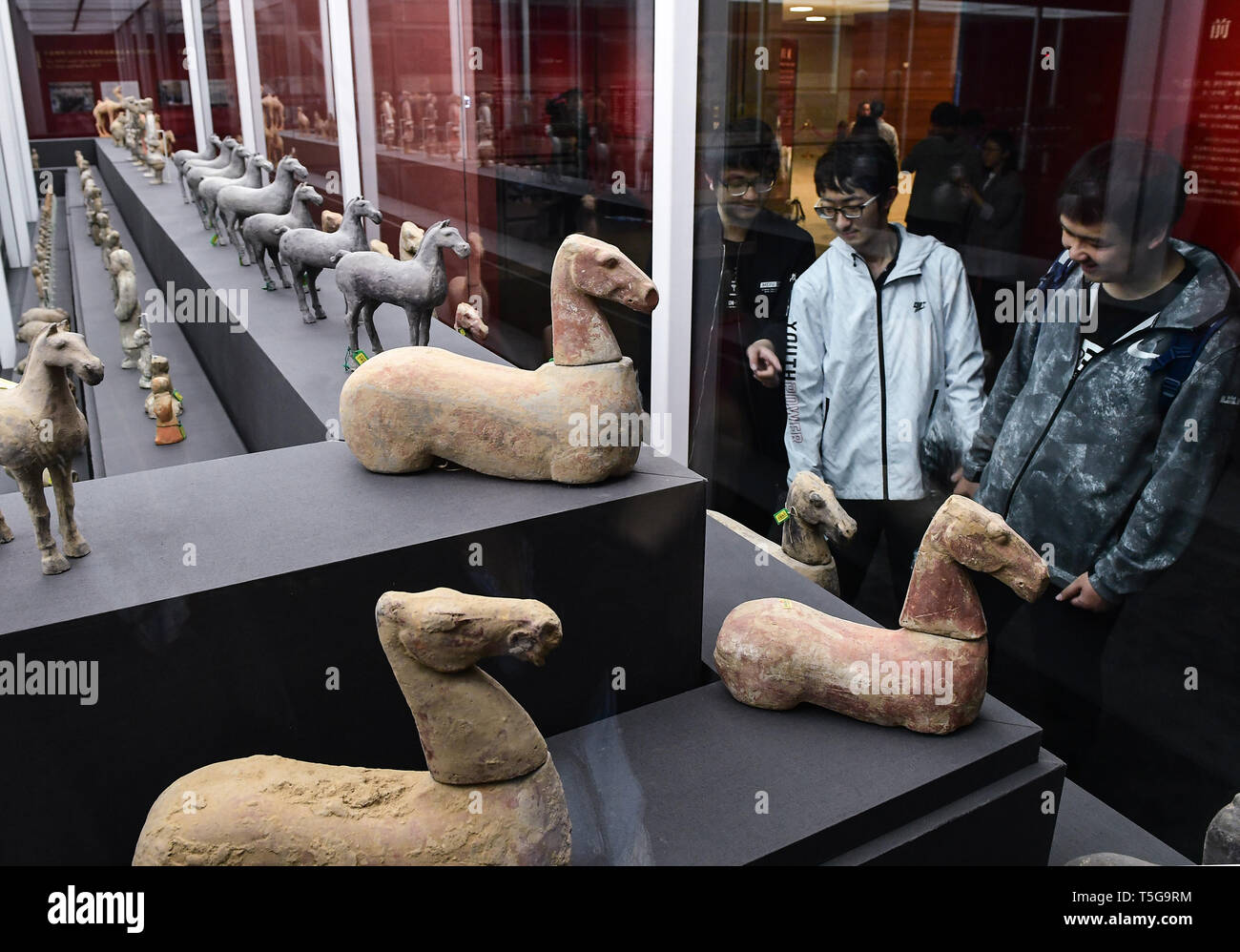 Beijing, China. 24th Apr, 2019. Visitors view cultural relics at the ...