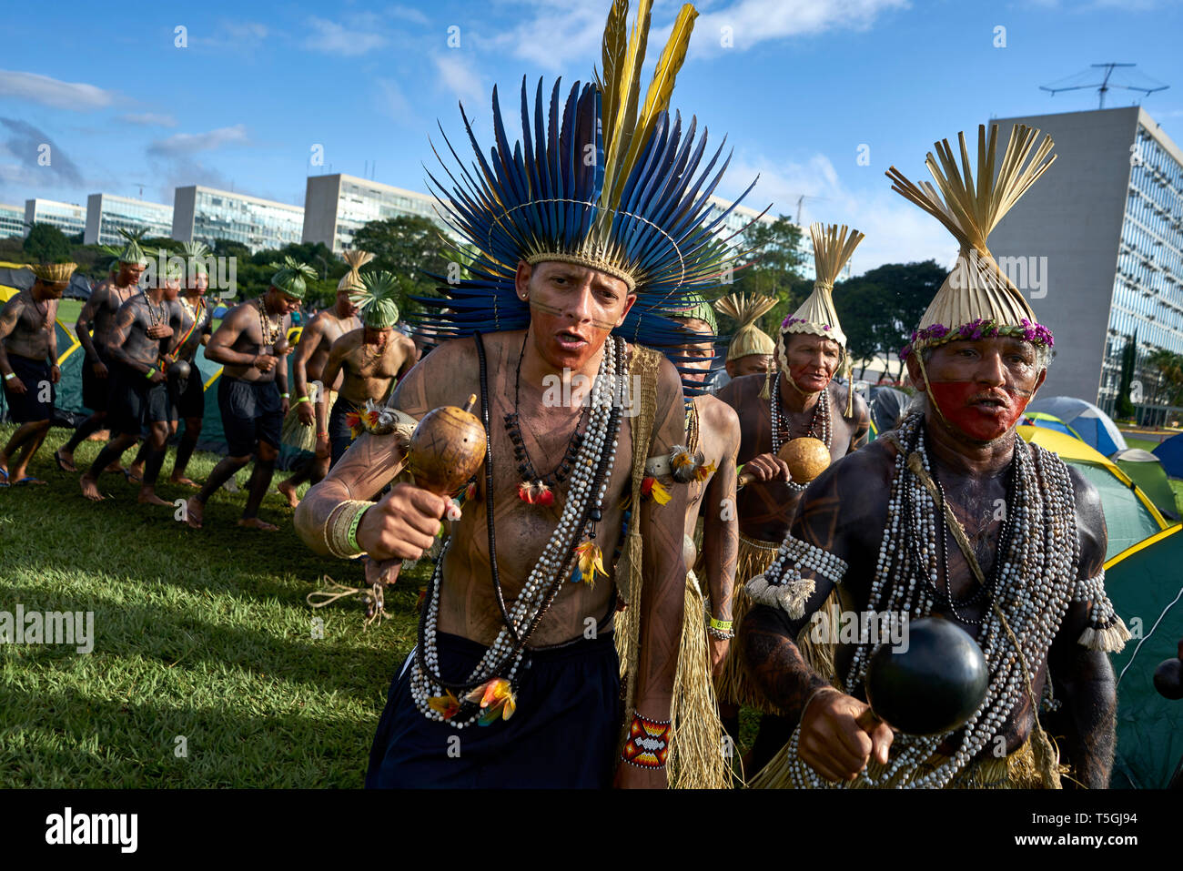 24 April 2019, Brazil, Brasilia: Junior Xucurú dances with his people ...