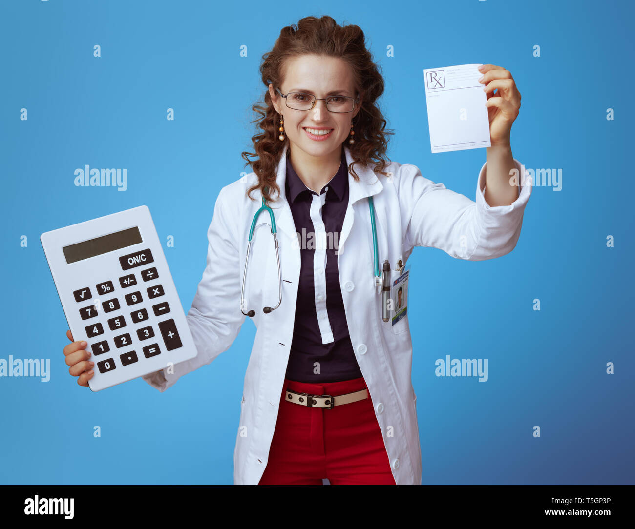happy modern medical doctor woman in bue shirt, red pants and white ...