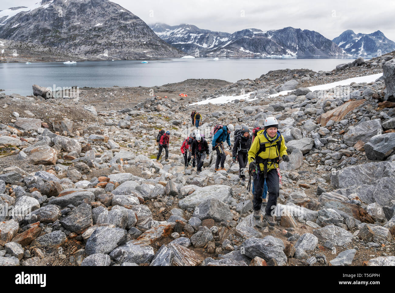 Greenland, Sermersooq, Kulusuk, Schweizerland Alps, group of people walking on rocks Stock Photo ...