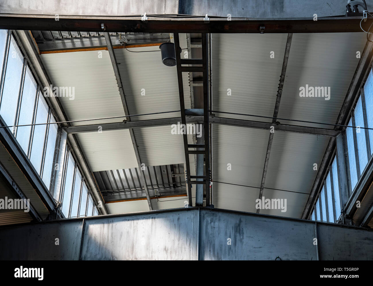 Ceiling of a warehouse with light openings and iron beams Stock Photo ...