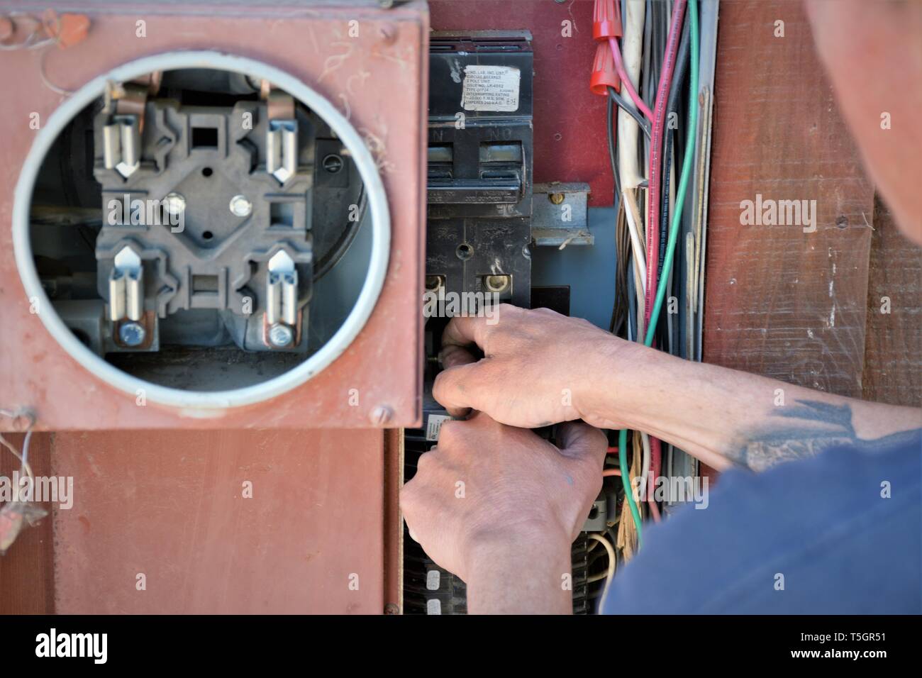 Repairs being done to faulty wiring in older home by trained and ...