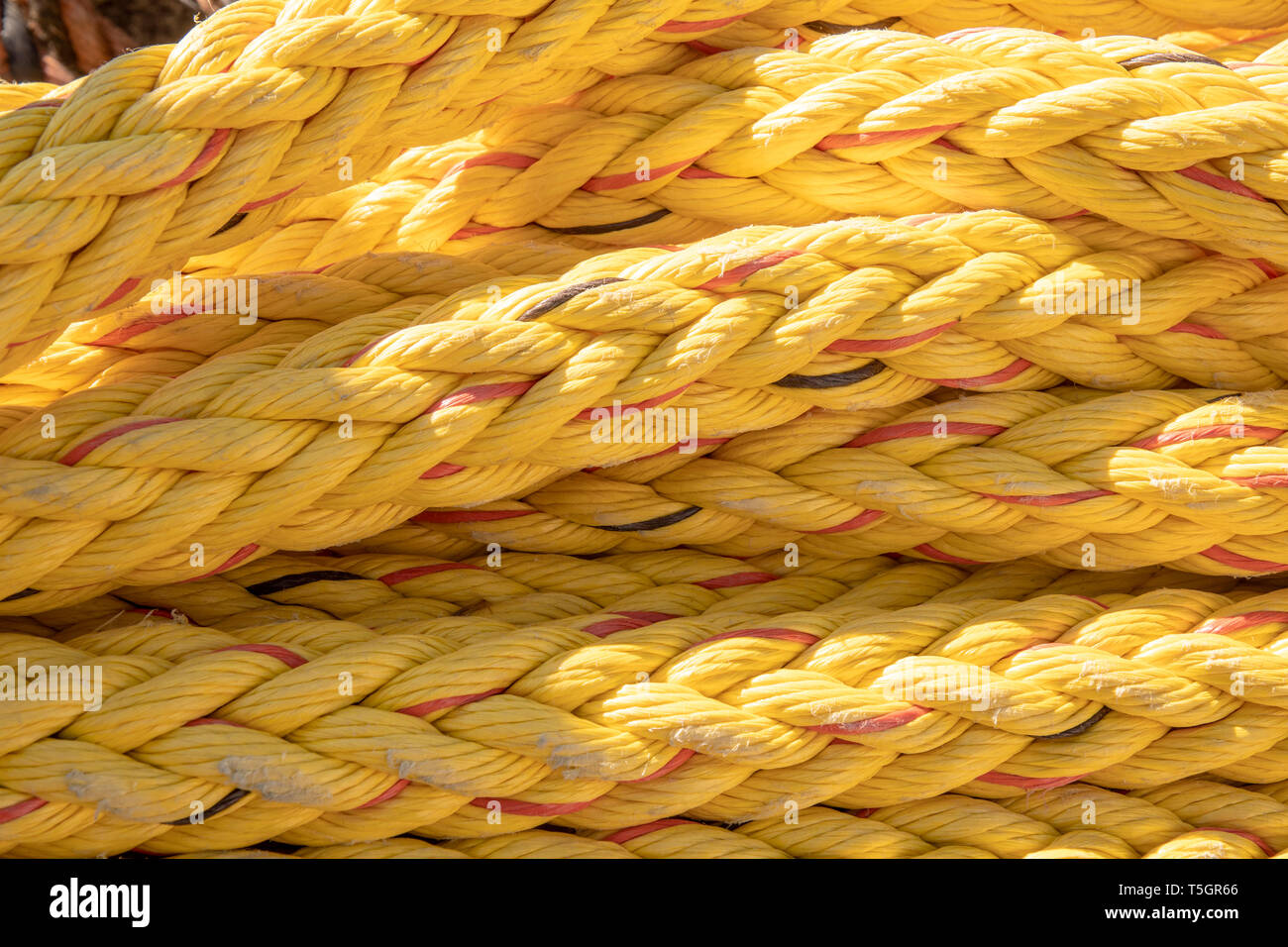 yellow rope wound by a ship Stock Photo - Alamy