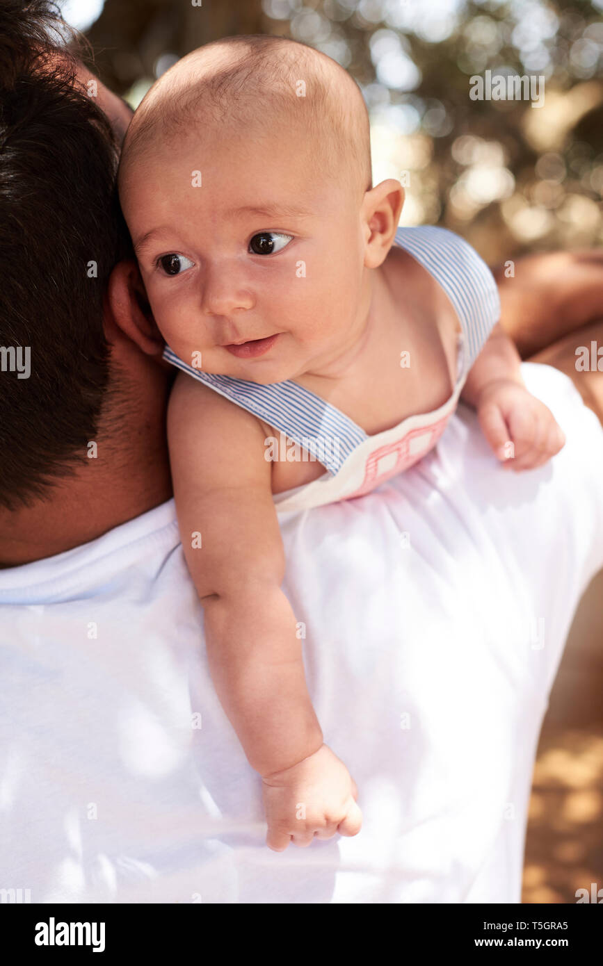 Father carrying little boy outdoors on his shoulder Stock Photo - Alamy