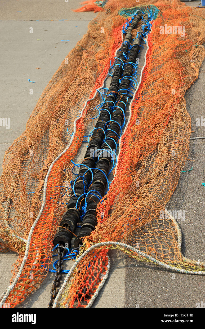 Fishing nets laid out in preparation for the days work Stock Photo - Alamy