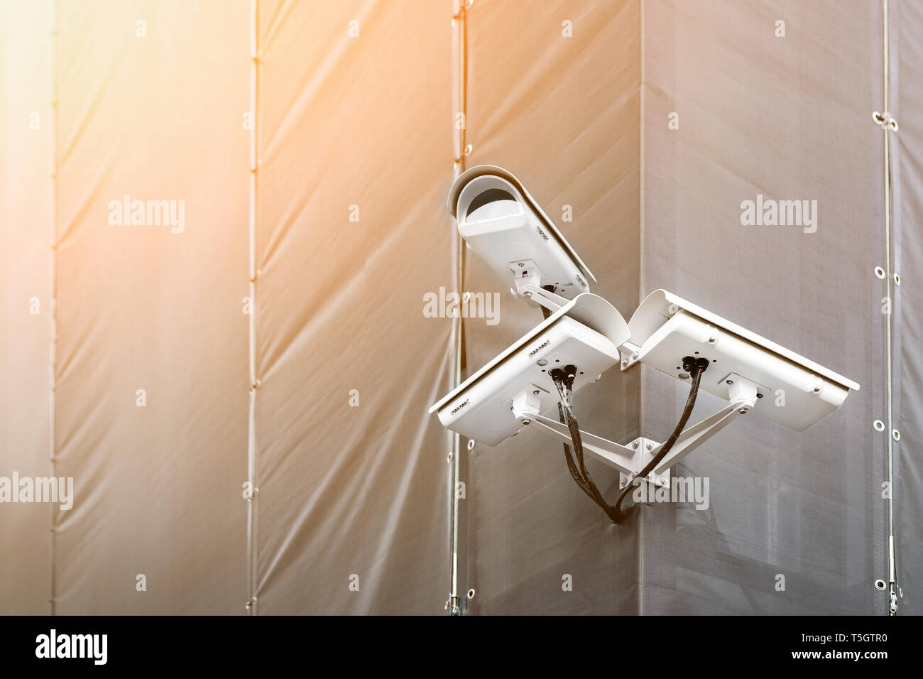 Three CCTV cameras on corner of building under restoration or renewal ...
