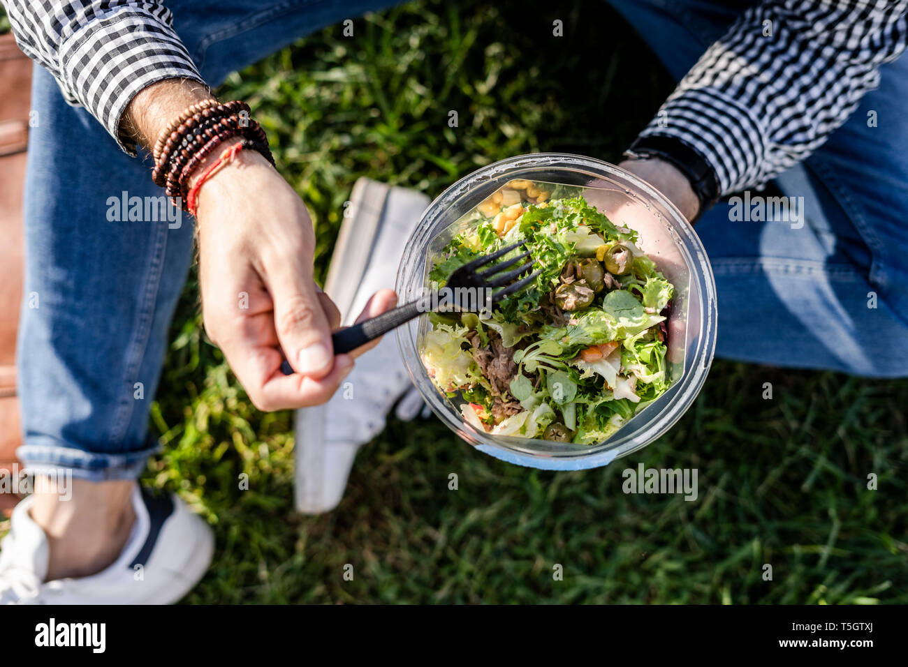 Man eating salad sitting on hi-res stock photography and images - Alamy