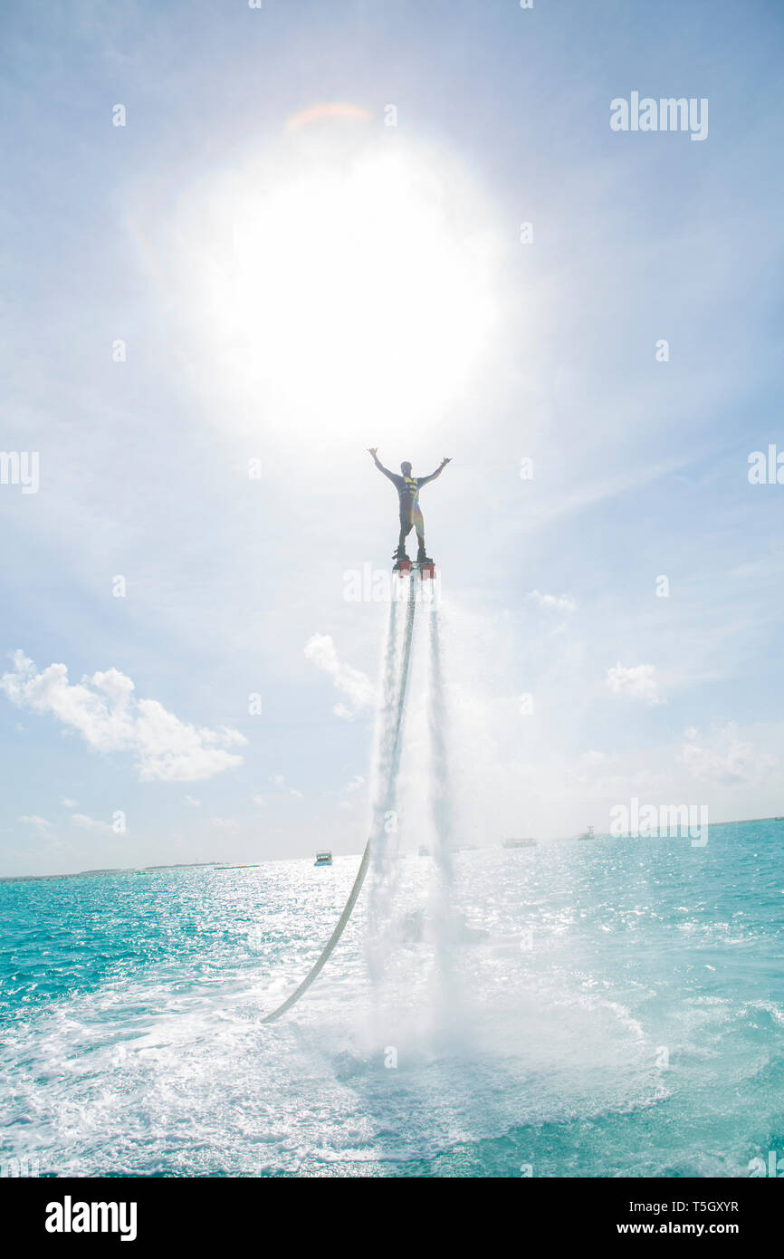 Maldives, man on flyboard above the sea Stock Photo - Alamy