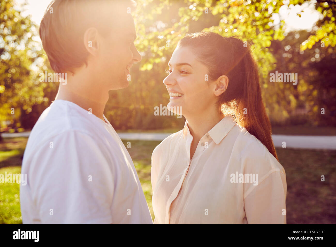 Young couple smiling at each other hi-res stock photography and images ...