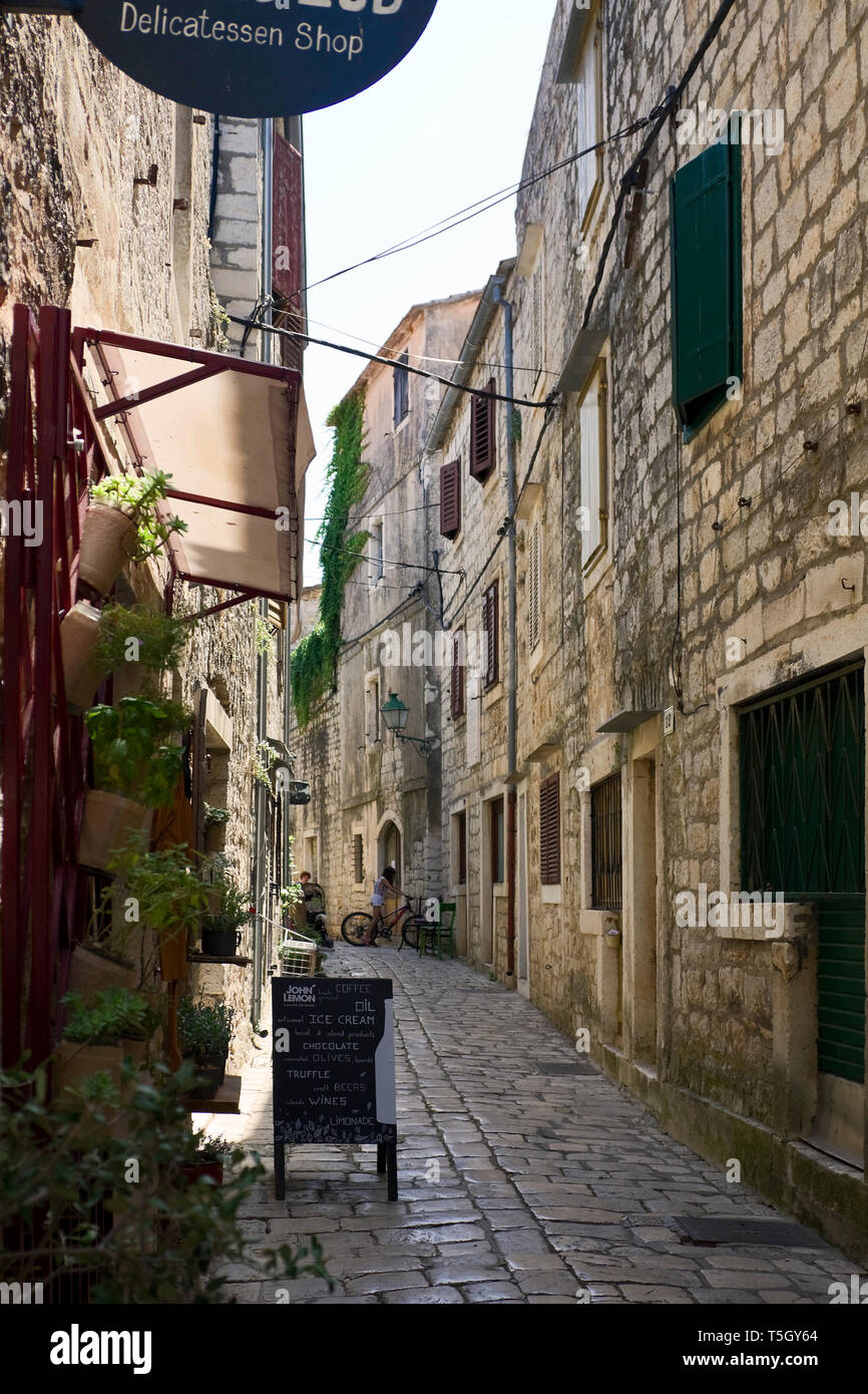 old town; narrow cobblestone street; pedestrian only, stone buildings ...