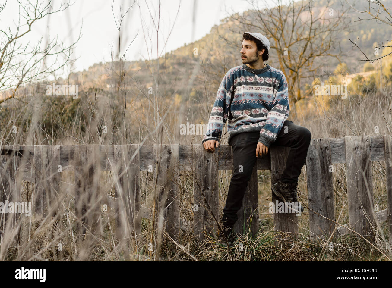 Man sitting fence hi-res stock photography and images - Alamy