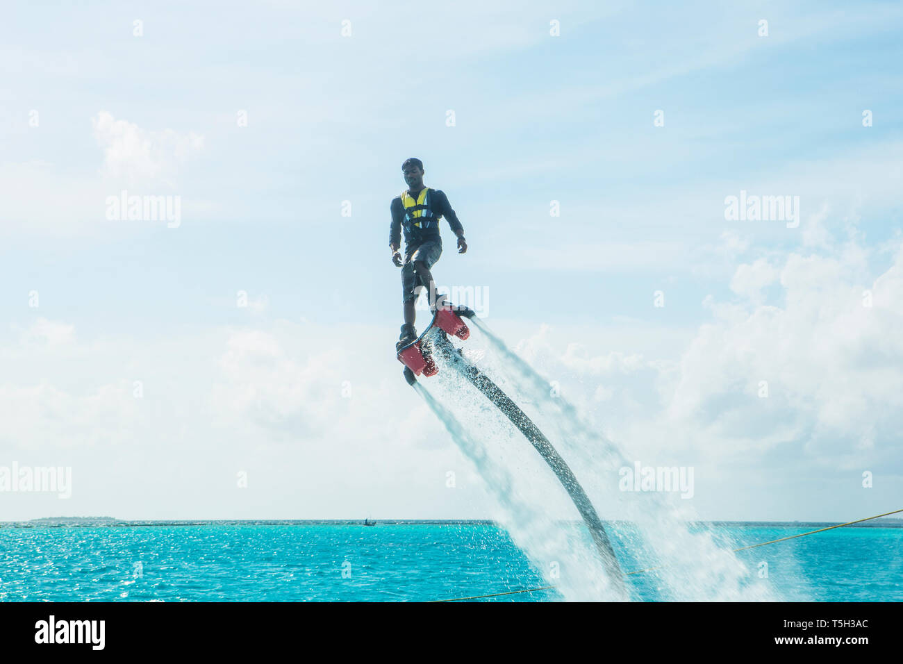 Maldives, man on flyboard above the sea Stock Photo - Alamy